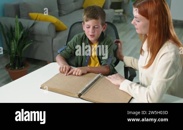 schooling for blind children, young teacher teaches visually impaired ...