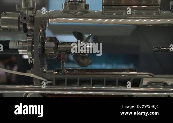 Close up of a metal steel new propeller spinning fast, industrial ...