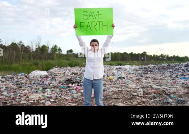 portrait young woman activist with a poster in hands save earth stands ...