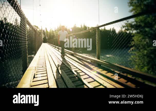 Man crossing hanging bridge Stock Videos & Footage - HD and 4K Video ...