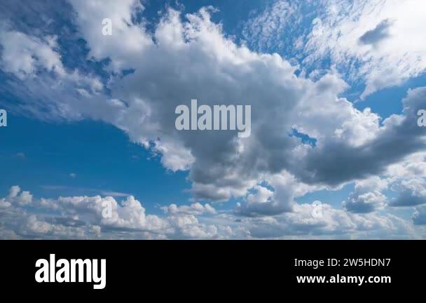 Blue sky white clouds. Puffy fluffy white clouds. Cumulus cloud cloudscape timelapse. Summer ...