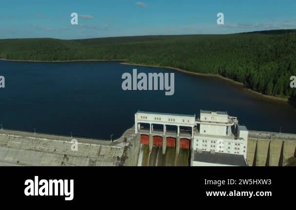 Hydroelectric dam with water flows through gates. Dam in Russia Stock ...