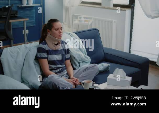 Adult with cold and flu wearing cervical neck collar Stock Video ...