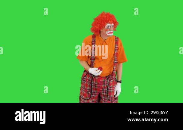 Clown taking off his red nose and smelling the air on a Green Screen ...