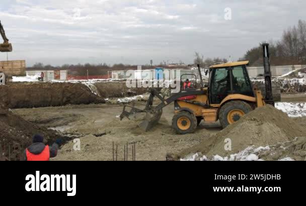Loader excavator, bulldozer and roller work on construction site ...