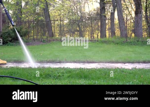 close up of female spray clean path with high water pressure. 4K Stock ...