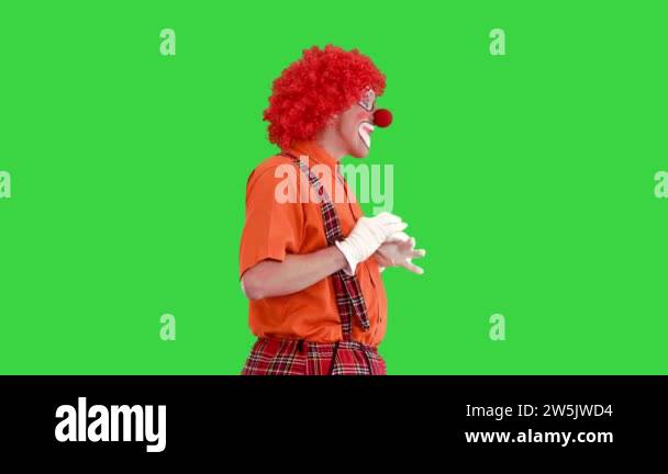 Shy Clown Thinking And Walking on a Green Screen, Chroma Key Stock ...