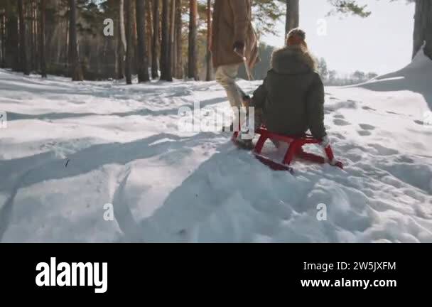 Parent pulling girl sled Stock Videos & Footage - HD and 4K Video Clips ...
