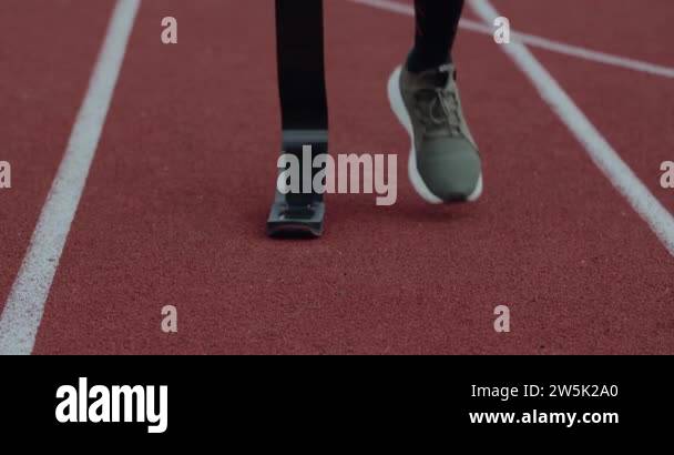 Crop view of disabled male person with prosthetic running blade walking ...