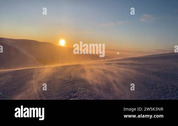 Blizzard and strong snow wind storm on mountain top. Blowing snow over ...