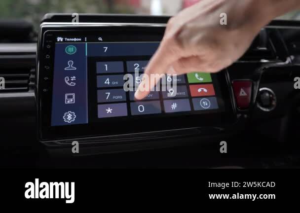Man finger dial numbers in digital dashboard using car smart multimedia ...