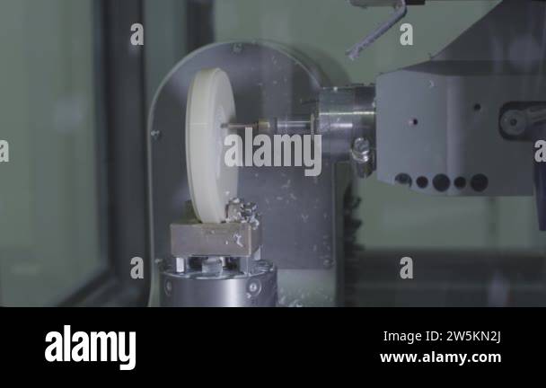 A professional CNC machine automatically creates a tooth prosthesis ...