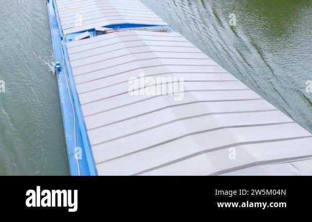 cargo barge floats on the river. Cargo transportation by water.River ...