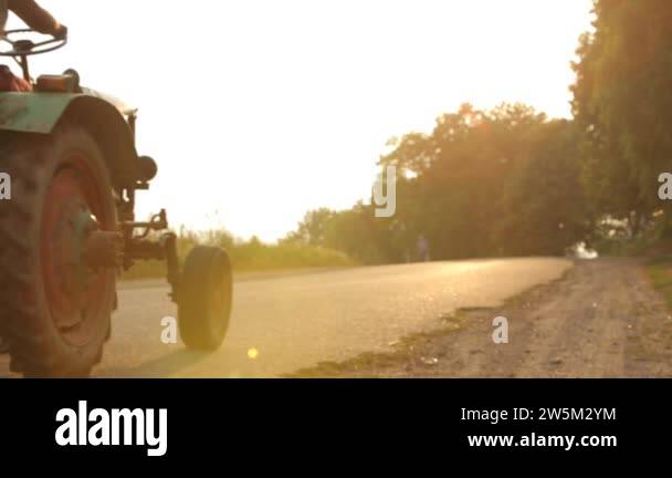 Road Tractor is Moving From Left to Right, carrying wood in the trunk ...