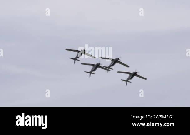 Diamond formation of four propeller aerobatic aircraft in inverted ...