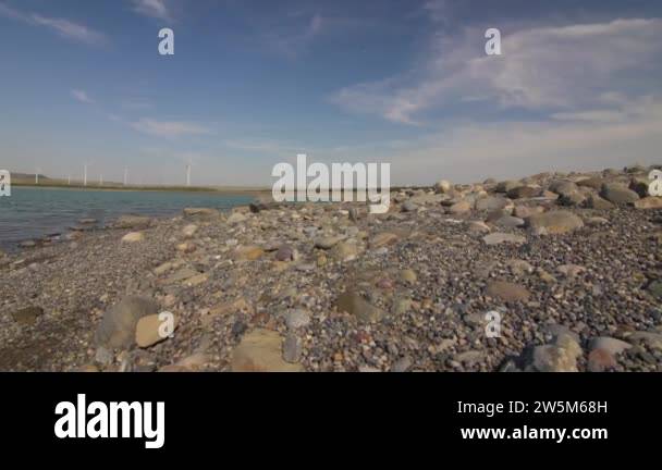 Slider movement of low lake water levels on Old Man Dam with windmills ...
