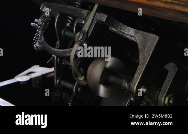 Macro detailed shot of the internal mechanisms of a classic phonograph ...