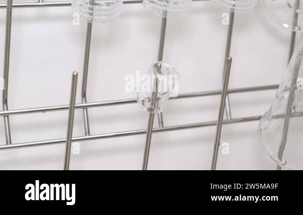 Washing of laboratory glassware and its drying. Clean beakers Stock ...