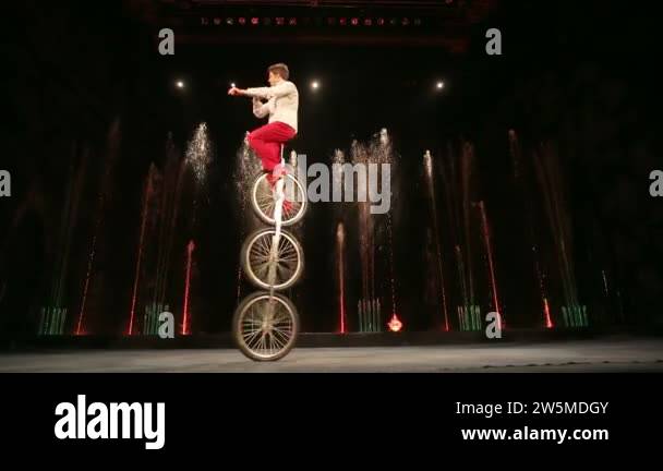 Balance-master performing on three wheeled cycle Stock Video Footage ...