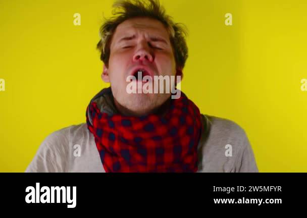 The man has a runny nose. Snot flows from the nose. A man has a cold ...