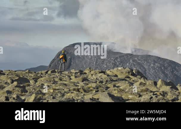 Man Watching Smoke Rise From Erupting Fagradalsfjall Volcano In Iceland ...