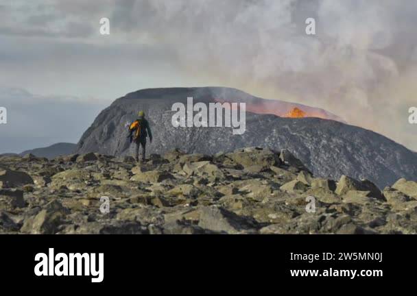 Man Walking Towards Erupting Fagradalsfjall Volcano In Reykjanes ...