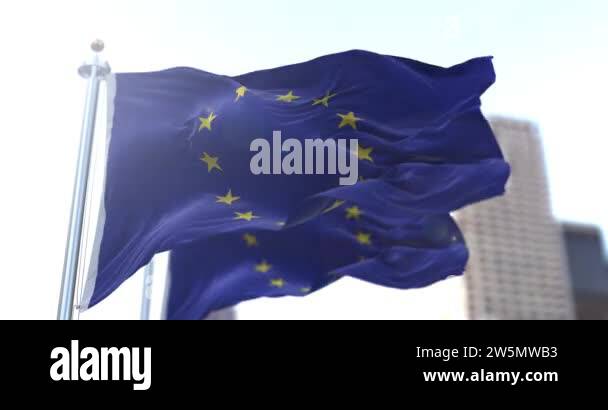 Two European flags flapping in the wind. European Union and Economic ...