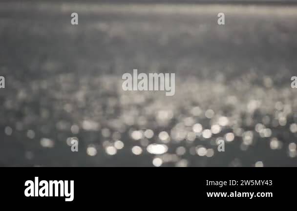 Bokeh sun glare reflection of Sunset sunrise light in water surface ...