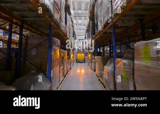 A huge warehouse filled with packed pallets. Logistics and storage of a ...