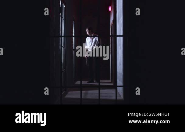 Horror acting - a dangerous male warden makes a tour of the cells in ...