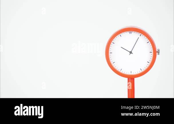 Round clock with white dial There is a handle and the rim of the watch ...