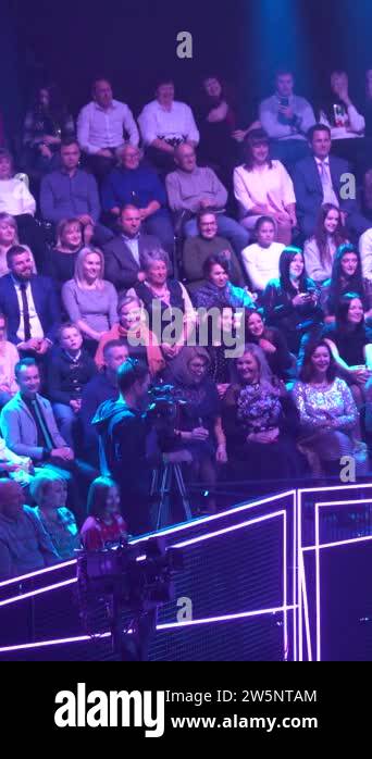 People viewers in a TV studio while recording a TV show. Vertical video ...