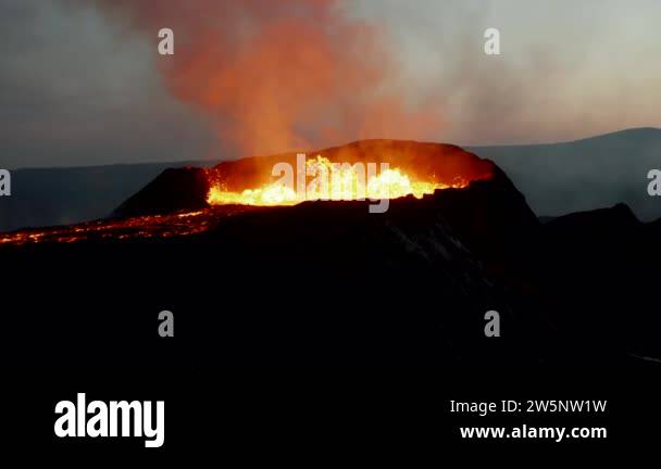 Fly around volcano crater during molten magma eruption. Stream of hot ...