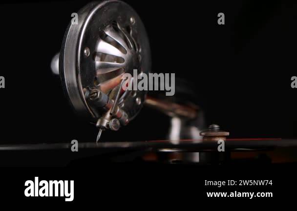 Large needle of a vintage gramophone on rotates vinyl record. Vintage ...