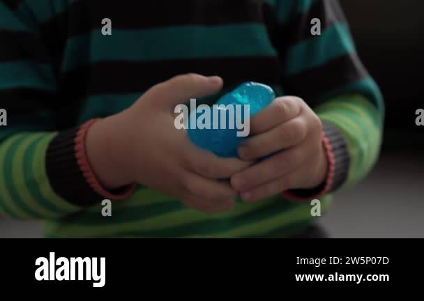Hands with blue and red slime close up. Girl and boy preschool minor ...