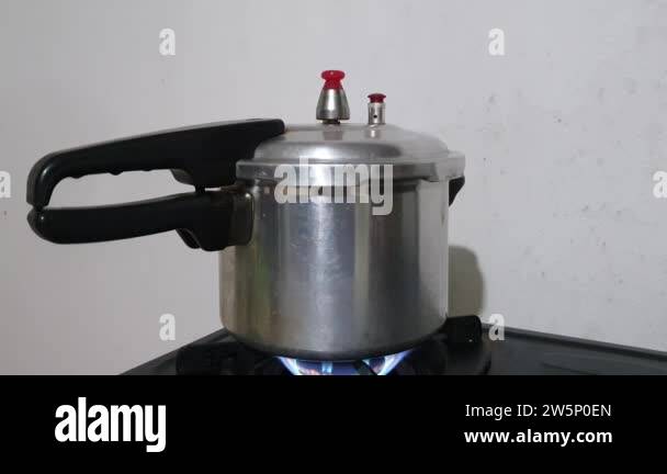Pressure cooker on stove Stock Videos & Footage - HD and 4K Video Clips ...