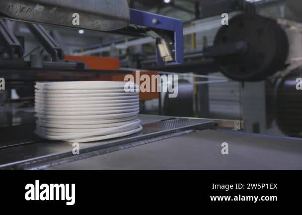 Modern cable manufacturing plant. Cable products packaging, automated ...