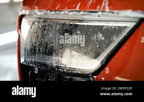 Close up to PPF installation process on a front rear headlight and ...