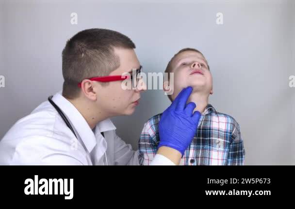 A pediatrician examines a boy who complains of a sore throat. Diagnosis ...