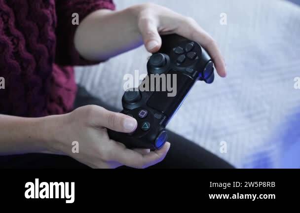 Video game wireless controller joystick. Hands pressing buttons on ...