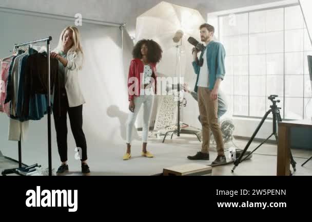 Backstage of the Photo Shoot: Stylist Chooses Outfit and Clothes for a ...