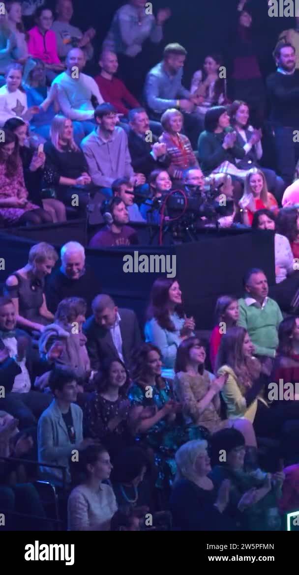 People viewers in a TV studio while recording a TV show. Vertical video ...