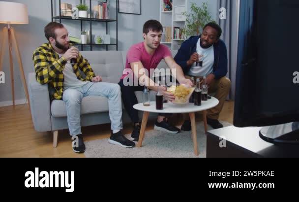 Three multi-ethnic male Caucasian and African American best friends ...