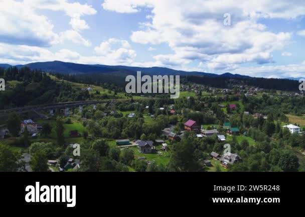 The viaduct in Vorokhta is a railway stone arch bridge across the Prut River aerial view Stock ...