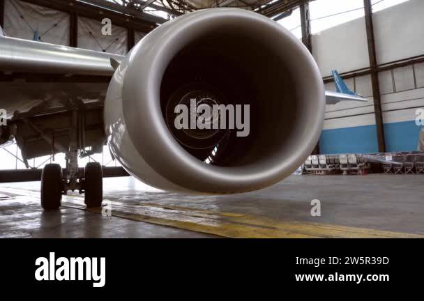 Airplane turbine close-up. Aircraft repair in the hangar. Engine ...