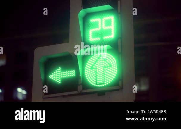 the traffic light with the left turn arrow is green and counting down ...