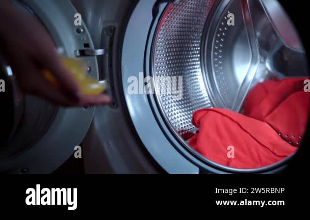 Routine hygiene concept, process of loading electric washing machine ...