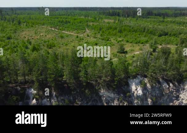 Steep slope and bottom of quarry for the extraction of gray granite ...