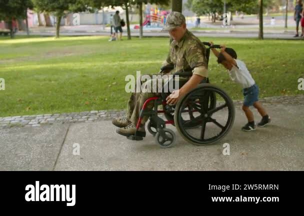 A boy helping a disabled boy Stock Videos & Footage - HD and 4K Video ...