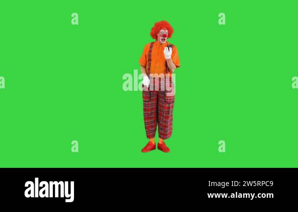 Clown with smartphone making a call on a Green Screen, Chroma Key Stock ...
